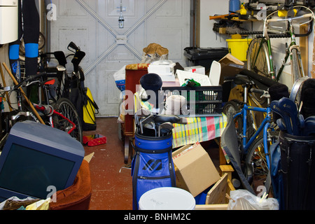 Messy domestic garage full of clutter Stock Photo - Alamy