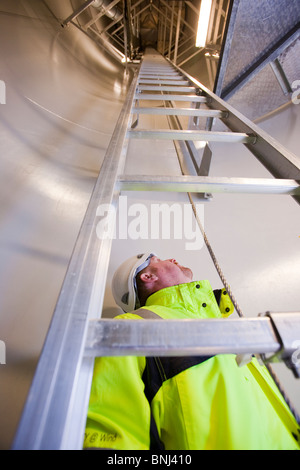 An engineer climbs the ladder of a Siemens wind turbine tower, destined ...