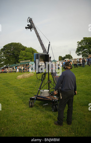 TV cameraman operating a broadcast camera Stock Photo - Alamy