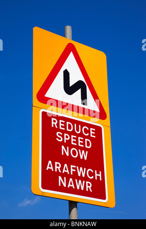 Bilingual Welsh road sign, (reduce speed now) Wales, UK Stock Photo - Alamy