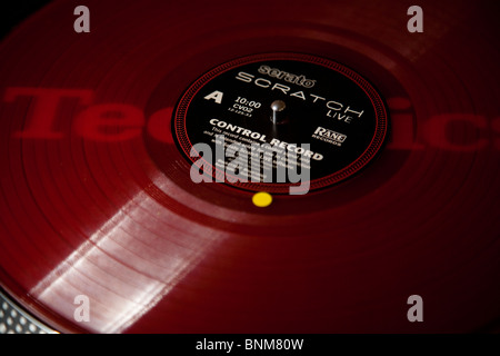 Red DJ scratch record on a technics turntable Stock Photo - Alamy
