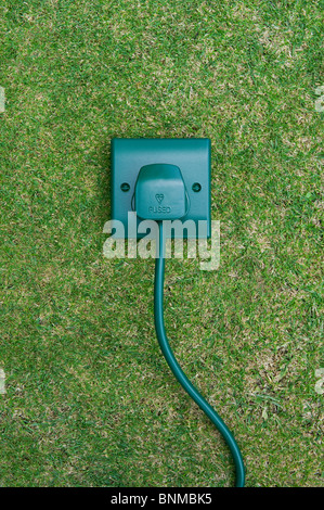 Socket in the lawn, green electricity Stock Photo - Alamy