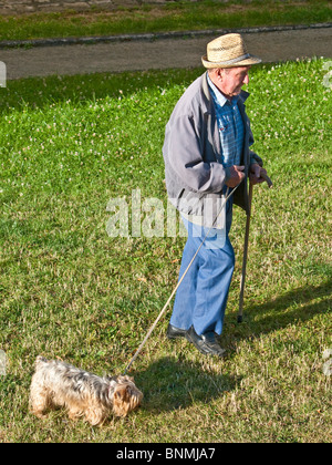 A middle aged man walking his dog at Plumpton Racecourse Stock Photo ...