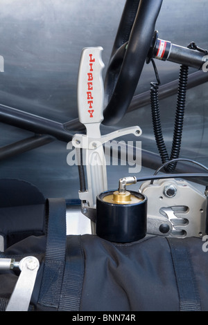 Cockpit in a drag racing car showing components and parts such as ...