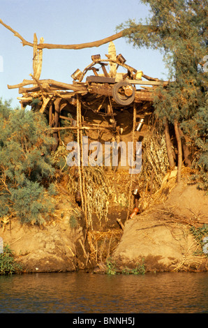 SHADUF. (Primitive Nile river water pump) The weight of the water in ...