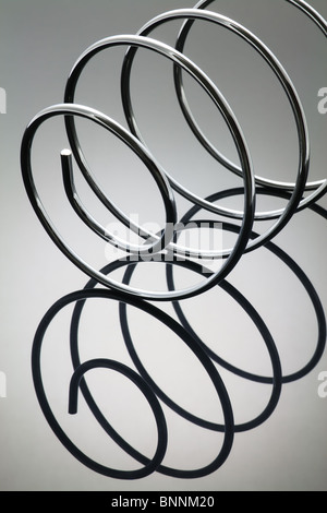 Closeup shot of silver coil wire on a black surface Stock Photo - Alamy