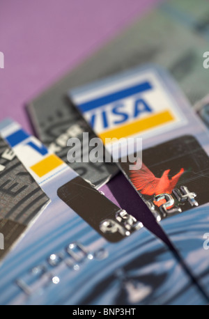 Scissors cutting up a MasterCard credit card Stock Photo - Alamy