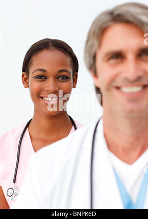 Portrait of positive medical team against a white background Stock ...