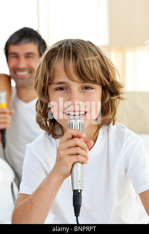 little boy singing into a microphone Stock Photo - Alamy