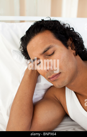 Man sleeping on bed and beautiful view of green lawn on background ...