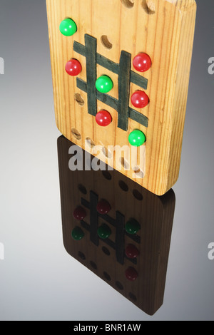 A vertical shot of Tic-tac-toe game in playground in black and white ...