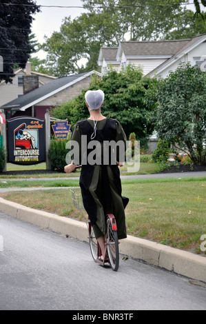 Amish girl riding scooter, Lancaster County, Pennsylvania, USA Stock ...