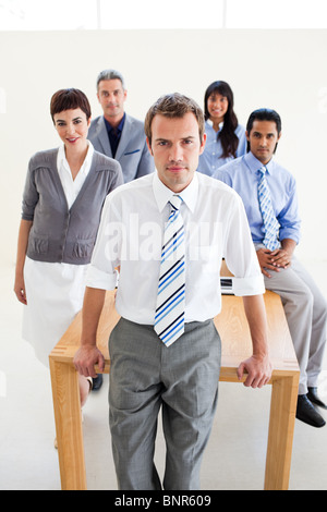 Business Team Around Table In Modern Office Collaborating Together ...