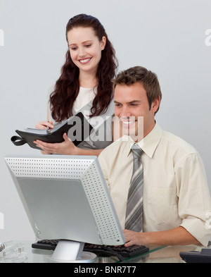 Assertive manager checking her employee's work Stock Photo - Alamy