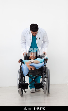 Doctor helping a sick child Stock Photo - Alamy