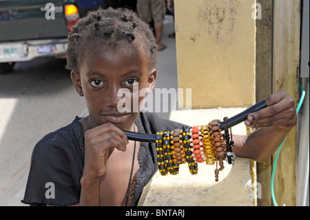 Native Honduran girl sells bracelets near Caribbean Cruise ship in Isla ...