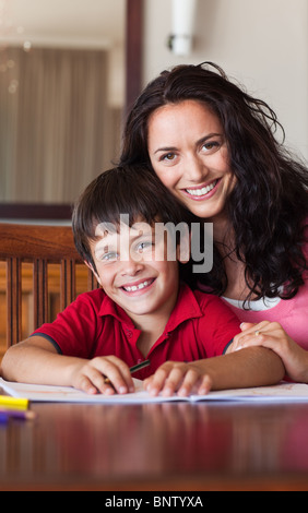 Delighted boy doing homework Stock Photo - Alamy