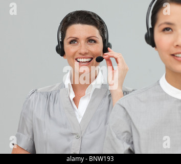 Two caucasian call center agents working at the office Stock Photo - Alamy
