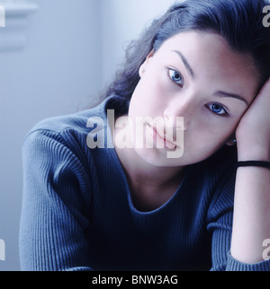 Girl in deep thoughtful thinking Stock Photo - Alamy