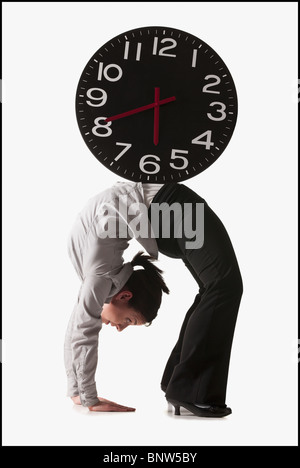 Female contortionist businesswoman bending over backwards Stock Photo ...