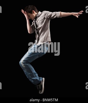 Male dancer performing a dance jump isolated on white background Stock ...