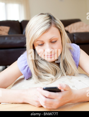 Beautiful young woman sending a text message on the beach Stock Photo ...