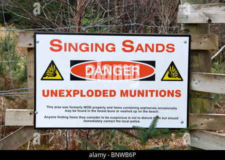 Warning notice sign Danger Unexploded ordnance on this beach it may ...