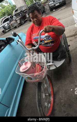 disabled man without legs parking his hand pedaling bicycle , klong ...