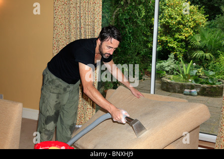Professional cleaner cleaning apartment furniture Stock Photo - Alamy