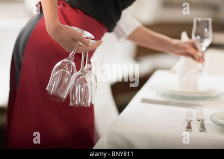 Waitress laying the table Stock Photo - Alamy