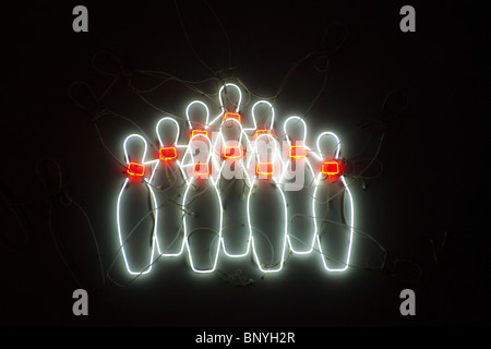 Bowling strike with neon ball and pins Stock Photo - Alamy