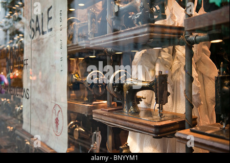 Antique sewing machines on display in a shop window in Brighton Stock ...