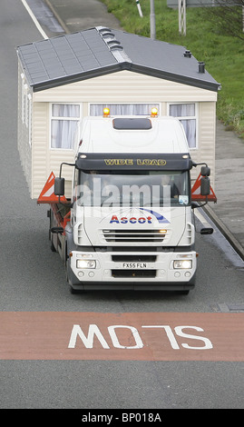 A mobile home is transported on the back of a lorry. Picture by James ...