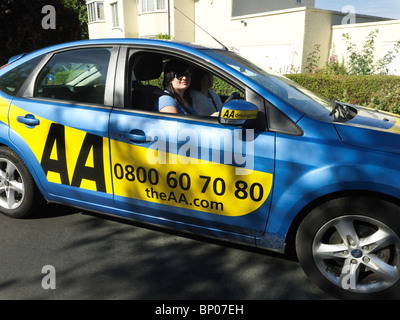 Learner driver having a driving lesson in a Red driver training car, UK ...