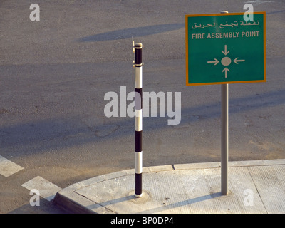 Assembly Point Sign in Arabic and English languages that uses safety ...