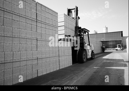 fork lift truck cement blocks Stock Photo - Alamy