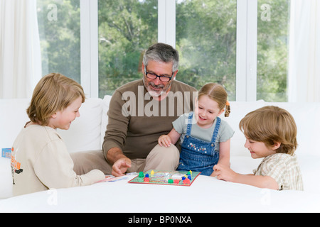 Family playing board game, Monopoly Stock Photo - Alamy