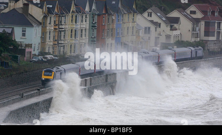 A train is battered by waves at Dawlish in Devon as storms hit the ...