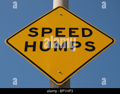 Caution speed bumps traffic sign Stock Photo - Alamy