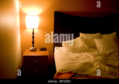 Unmade bed hotel bedroom sheets ruffled mess messy pillow untidy Stock ...