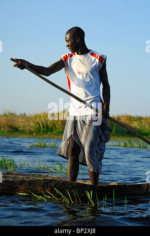 Local Bayei people in the tradiional mokoro dugout boat, Okavango Delta ...