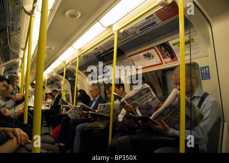 women reading on London Underground train Stock Photo: 7922768 - Alamy