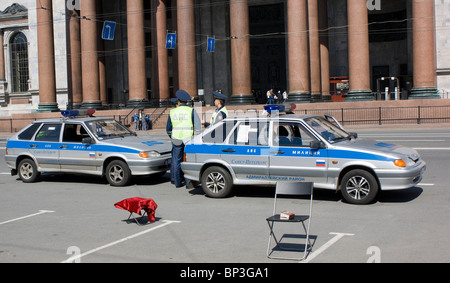Russian police officer and patrol vehicle parked at the street in Stock ...