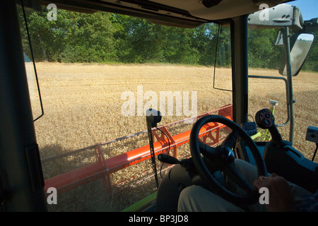 The inside of a modern combine harvester. Steering wheel, seat, side ...