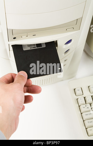 desktop computer with floppy disk in drive Stock Photo - Alamy