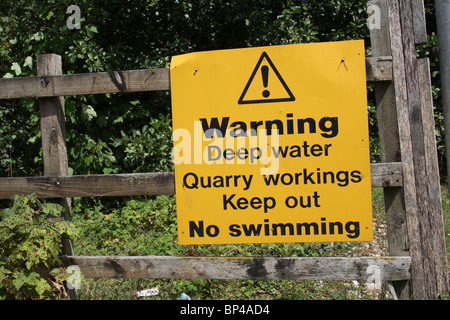 danger deep quarry warning sign at limestone quarry UK Stock Photo ...