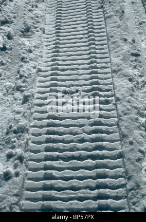 snowmobile tracks in snow across frozen field Canada Stock Photo - Alamy