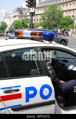 France, Paris, police car patrolling city street at night Stock Photo ...