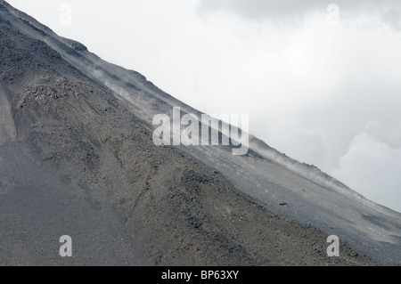 Pyroclastic bombs of ash, dust and gas roll down the cone of Arenal ...