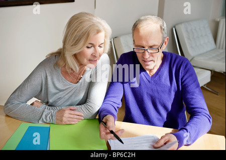 Couple sorting out bills Stock Photo - Alamy